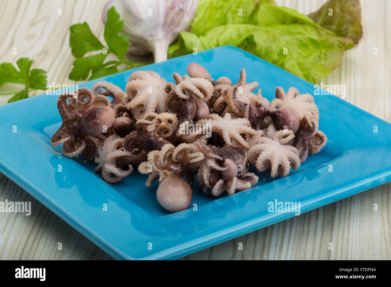 Boiled octopus - mini seafood in the bowl Stock Photo - Alamy