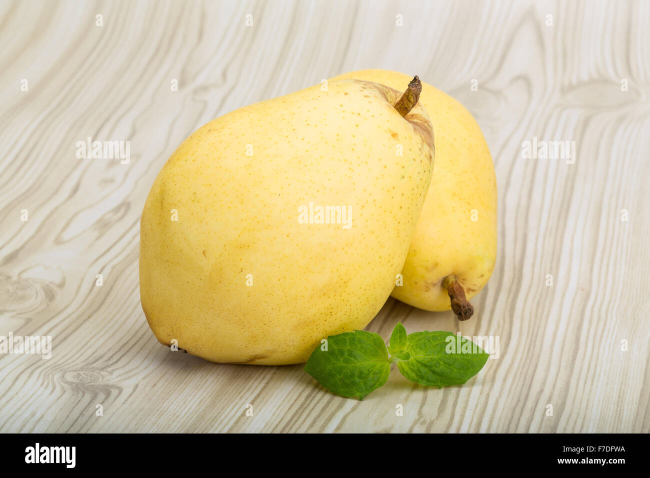 Bright ripe Yellow pears with mint leaves Stock Photo - Alamy