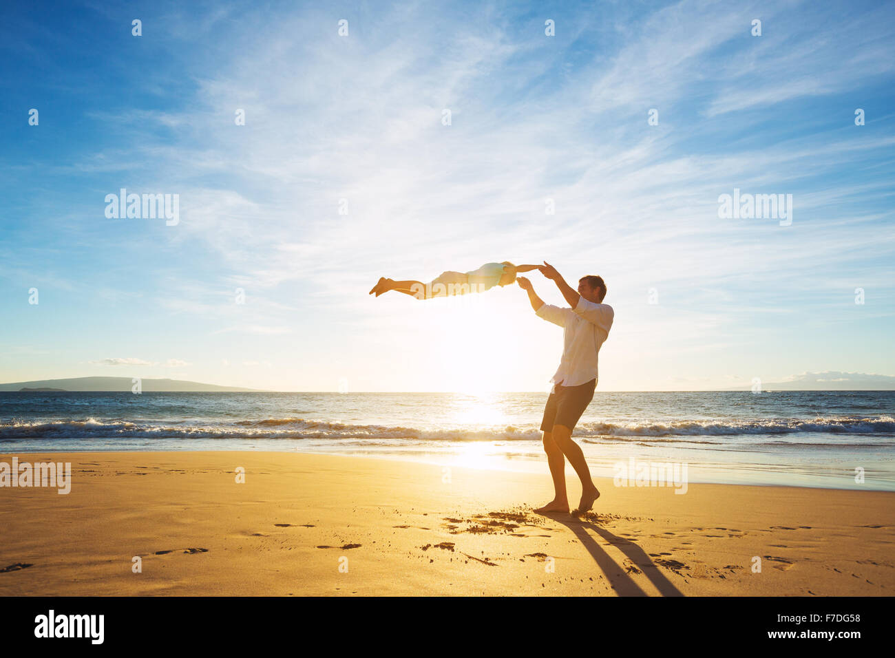 Happy Joyful Father and Son Playing on the Beach at Sunset. Fatherhood ...