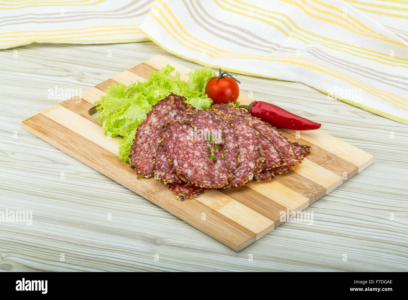 Sliced salami - with herbs and spices Stock Photo - Alamy