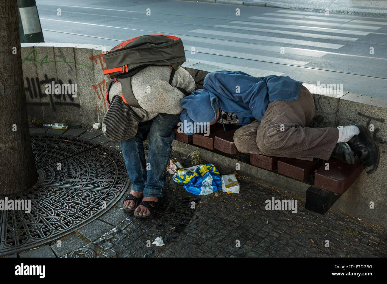 homeless men on a bench in Prague Stock Photo - Alamy