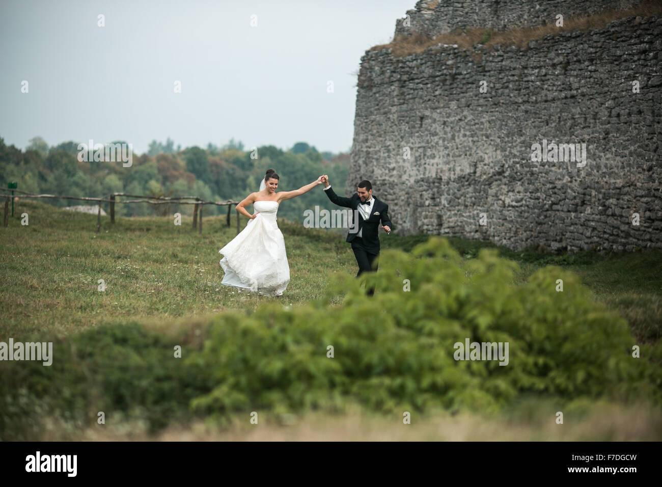 Married wedding couple walking away hi-res stock photography and images ...
