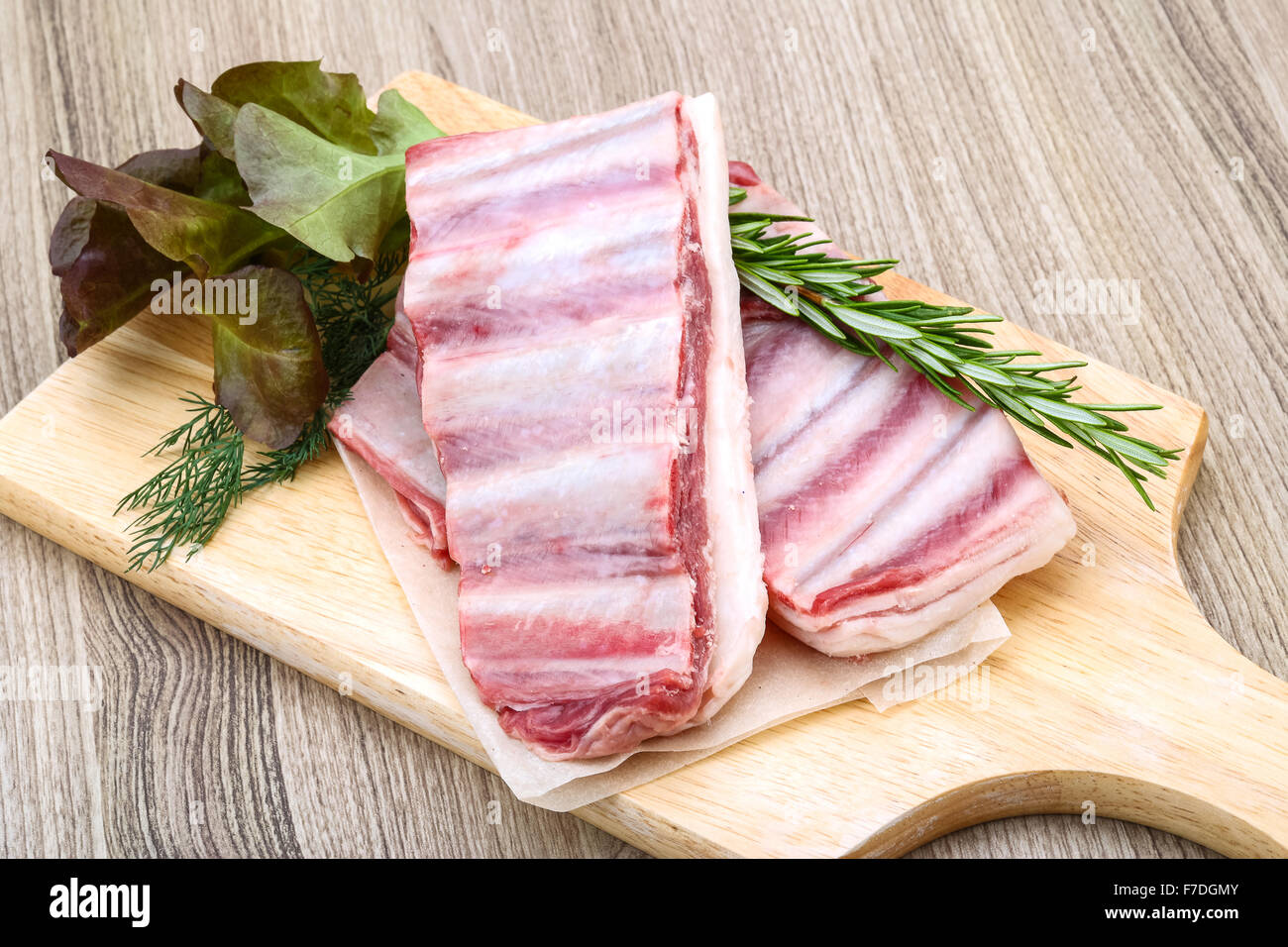 Fresh cold Raw lamb ribs with garlik and pepper - ready for cooking ...