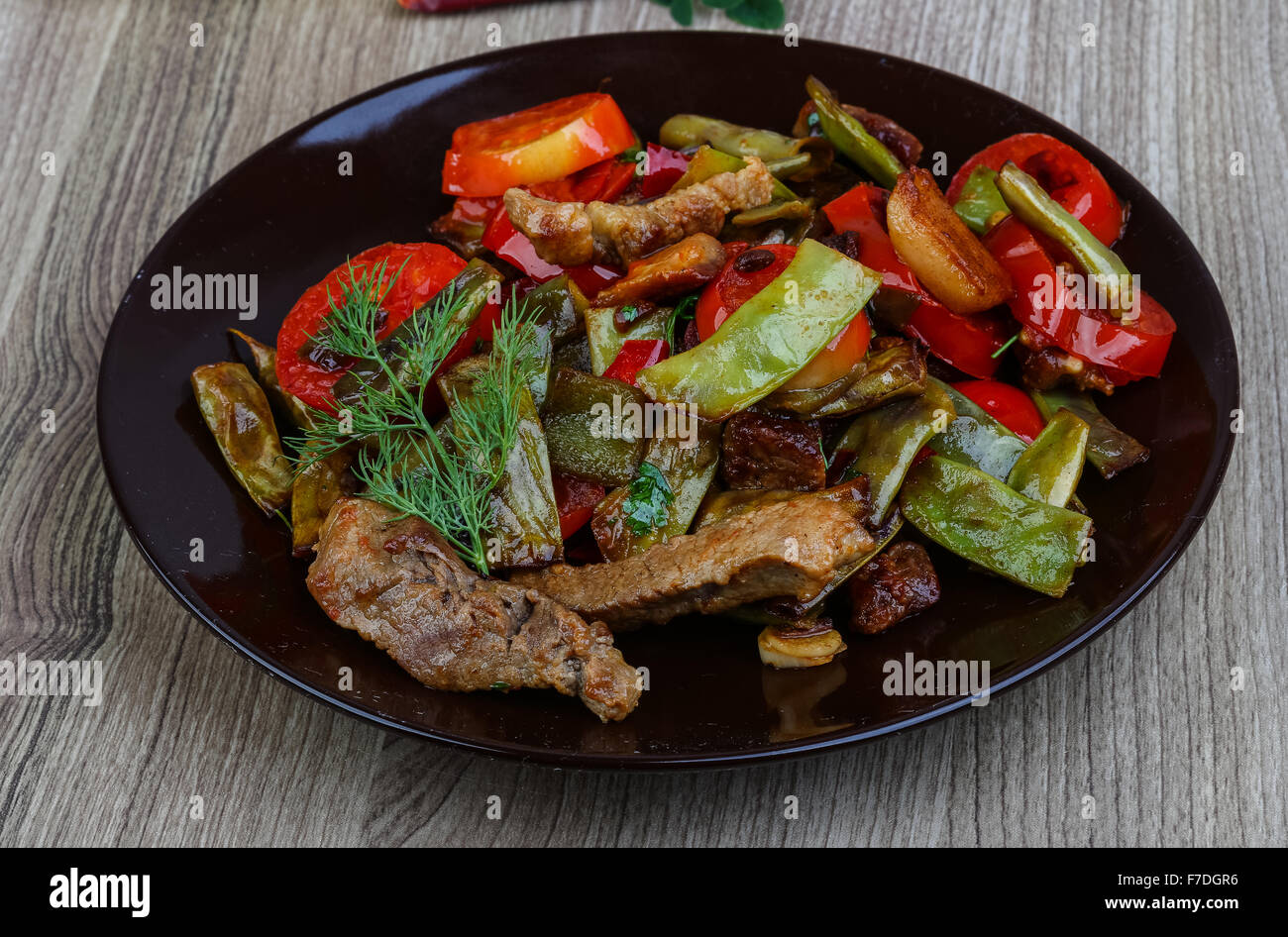 Asian cuisine - Stir fried pork with vegetables Stock Photo - Alamy