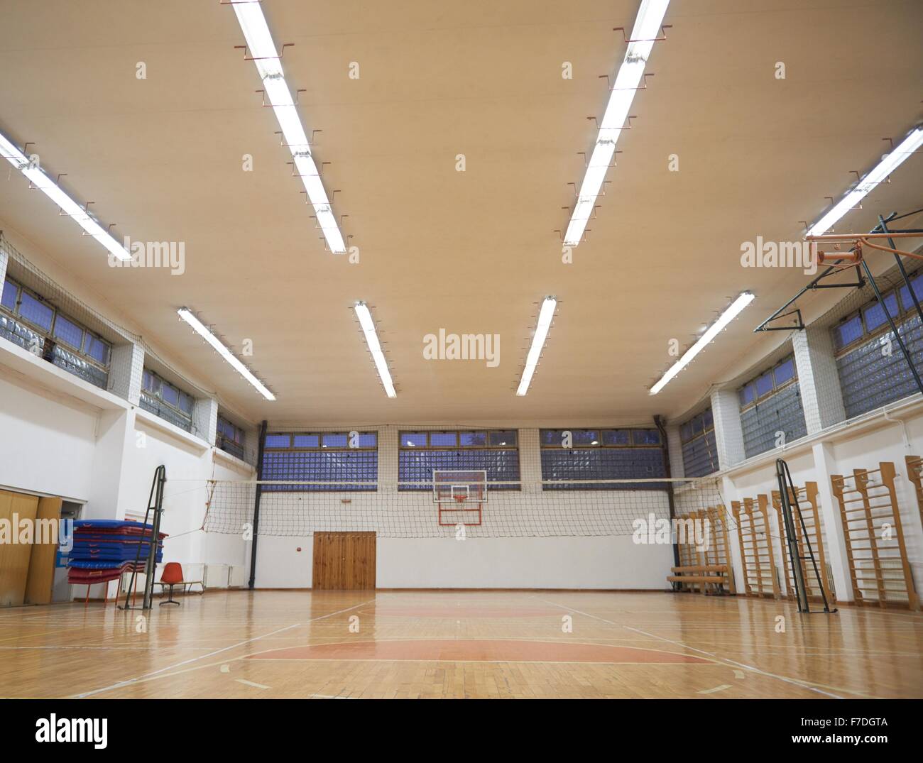 elementary school gym indoor with volleyball net Stock Photo - Alamy