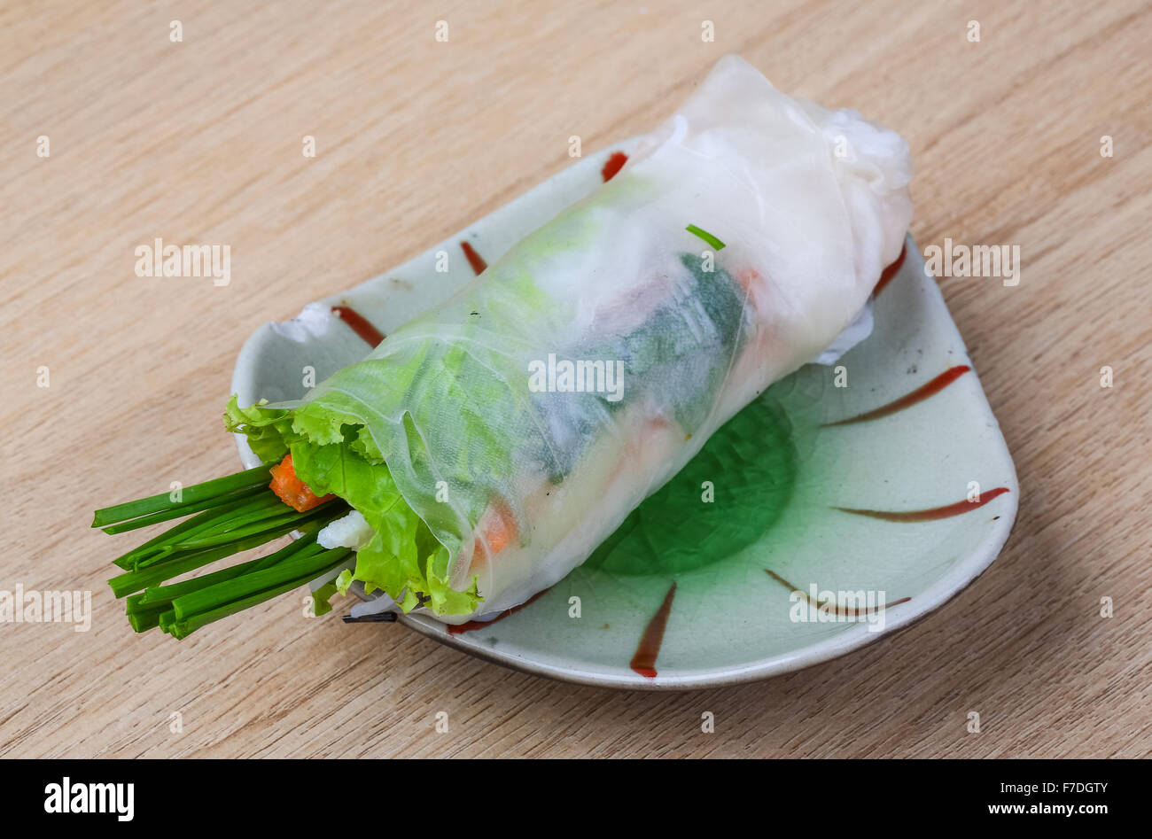 Asian traditional spring rolls on the wood background Stock Photo - Alamy