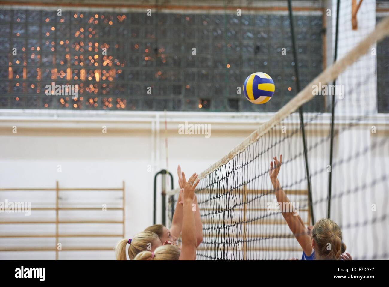 volleyball game sport with group of young beautiful girls indoor in ...