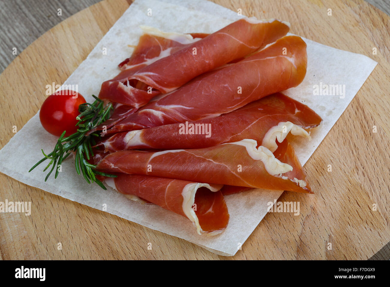 Spanish traditional snack - Jamon with tomato and rosemary Stock Photo ...
