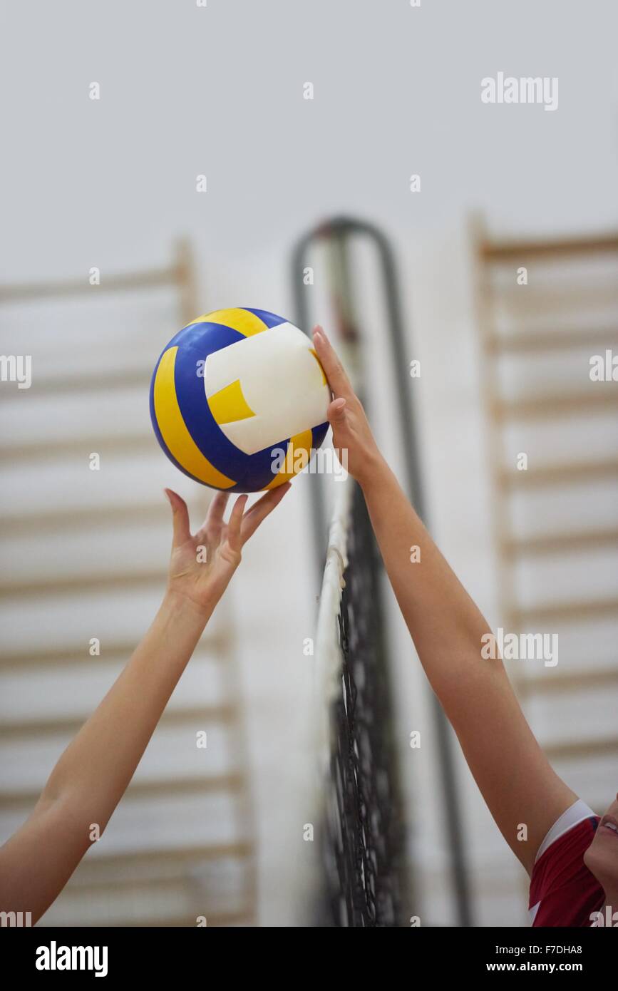 volleyball game sport with group of young beautiful girls indoor in ...