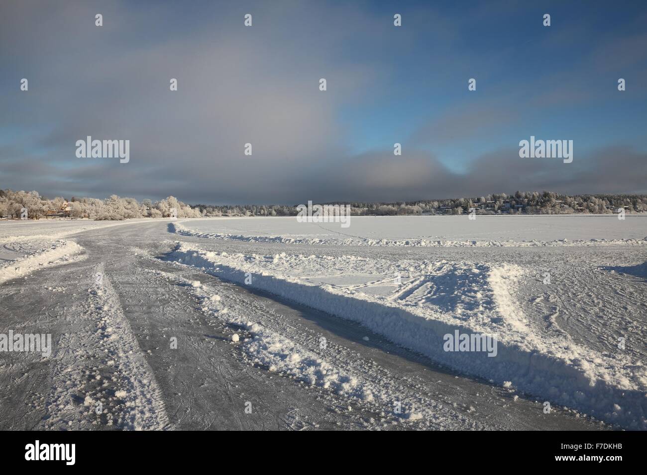 Frozen lake with ice road Stock Photo - Alamy