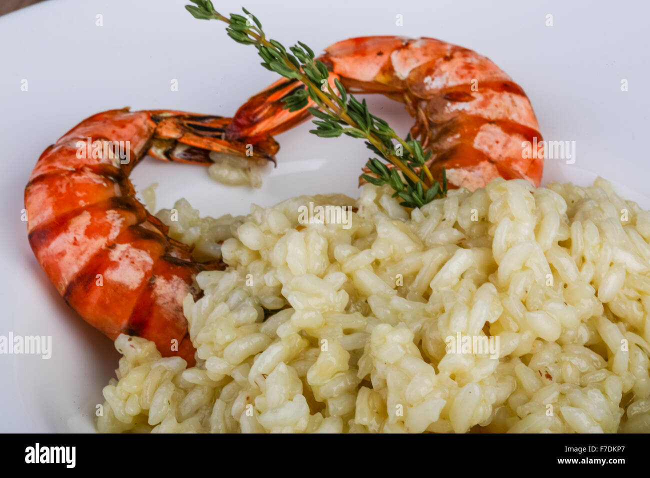 Italian trditional Risotto with tiger prawn and thyme Stock Photo - Alamy