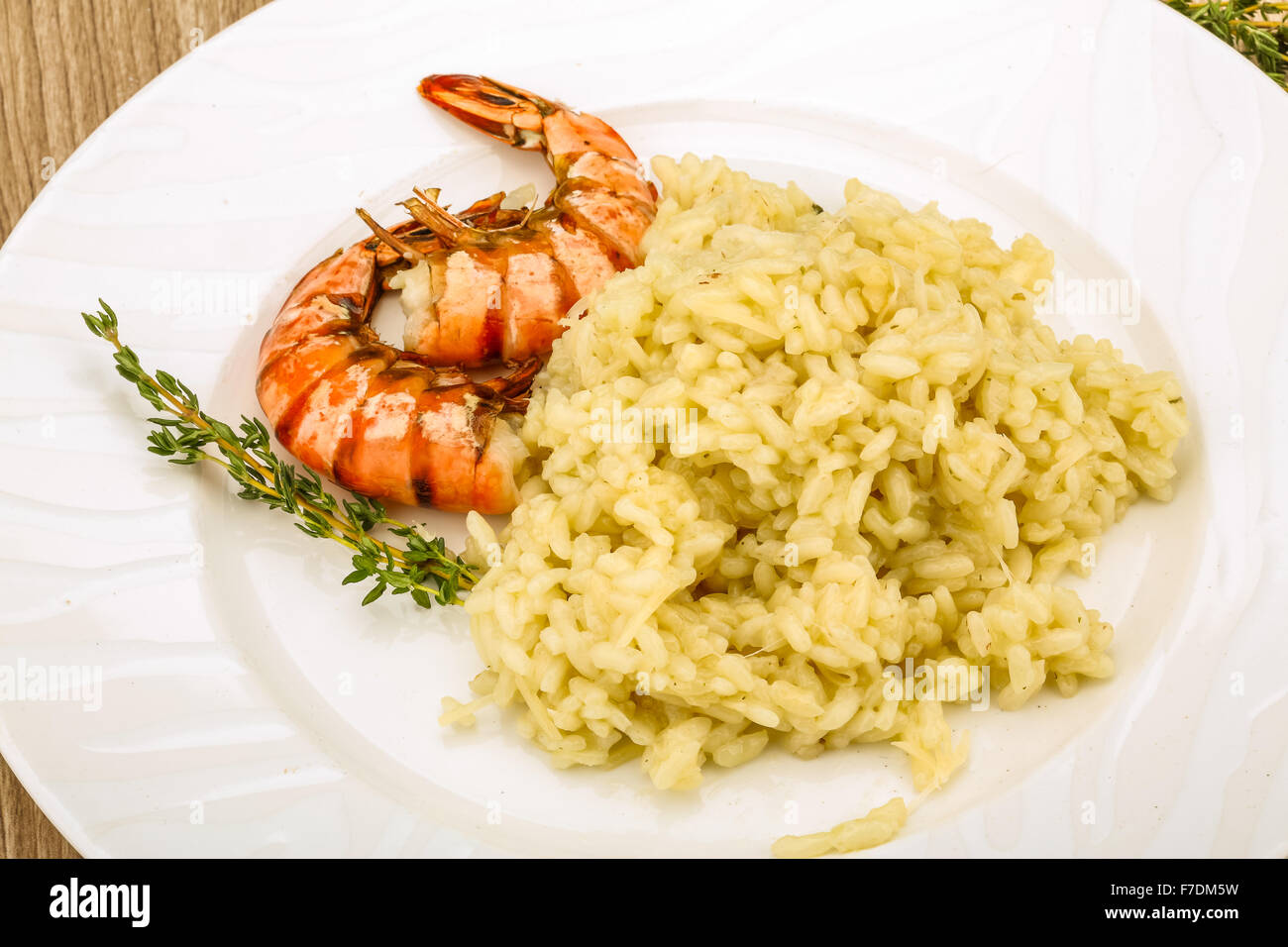 Italian trditional Risotto with tiger prawn and thyme Stock Photo - Alamy