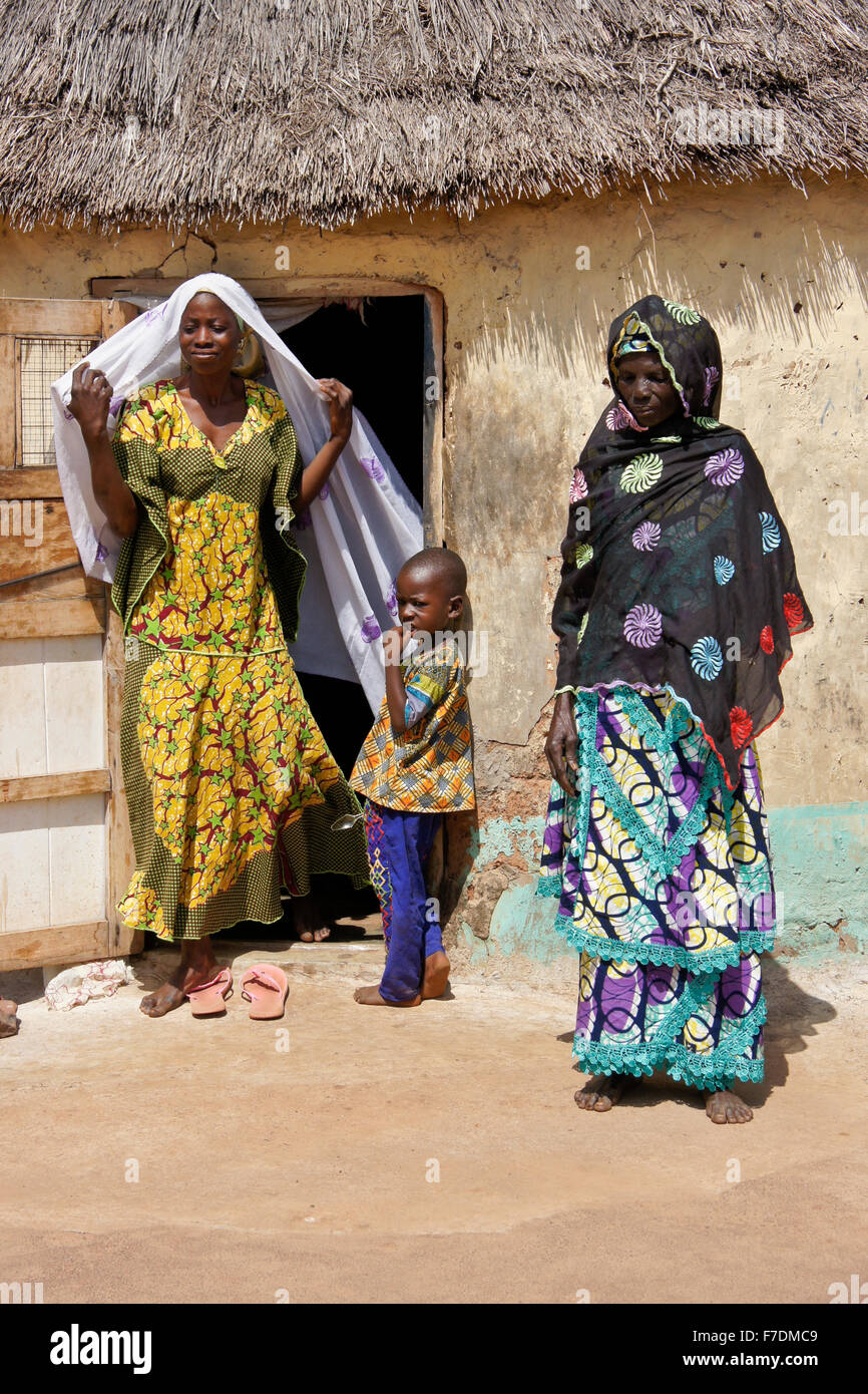 Women and boy of Dagomba tribe in traditional dress, Mbanayili village ...