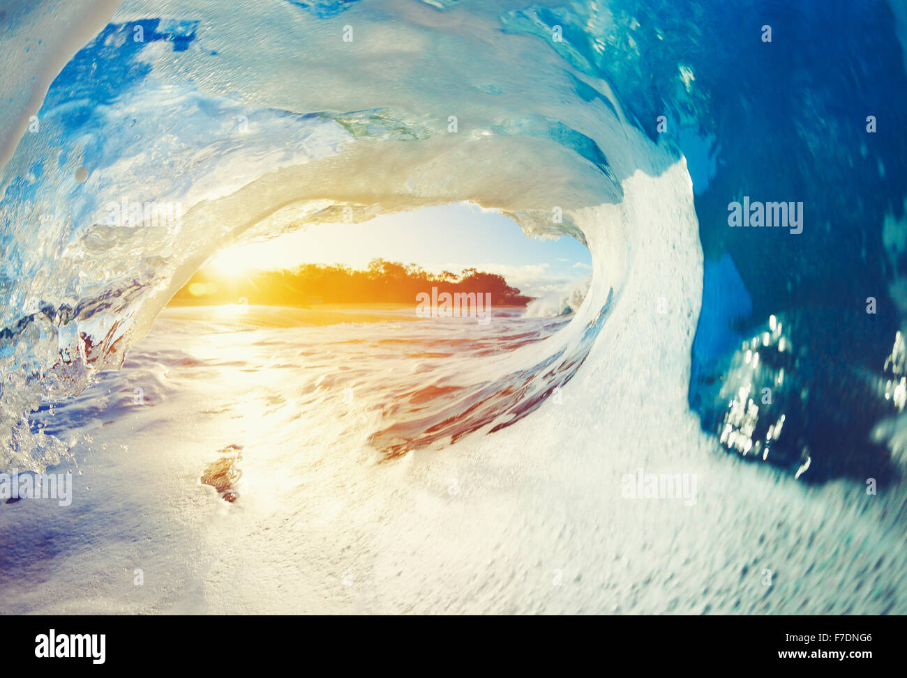 Blue Ocean Wave Crashing at Sunrise Stock Photo - Alamy