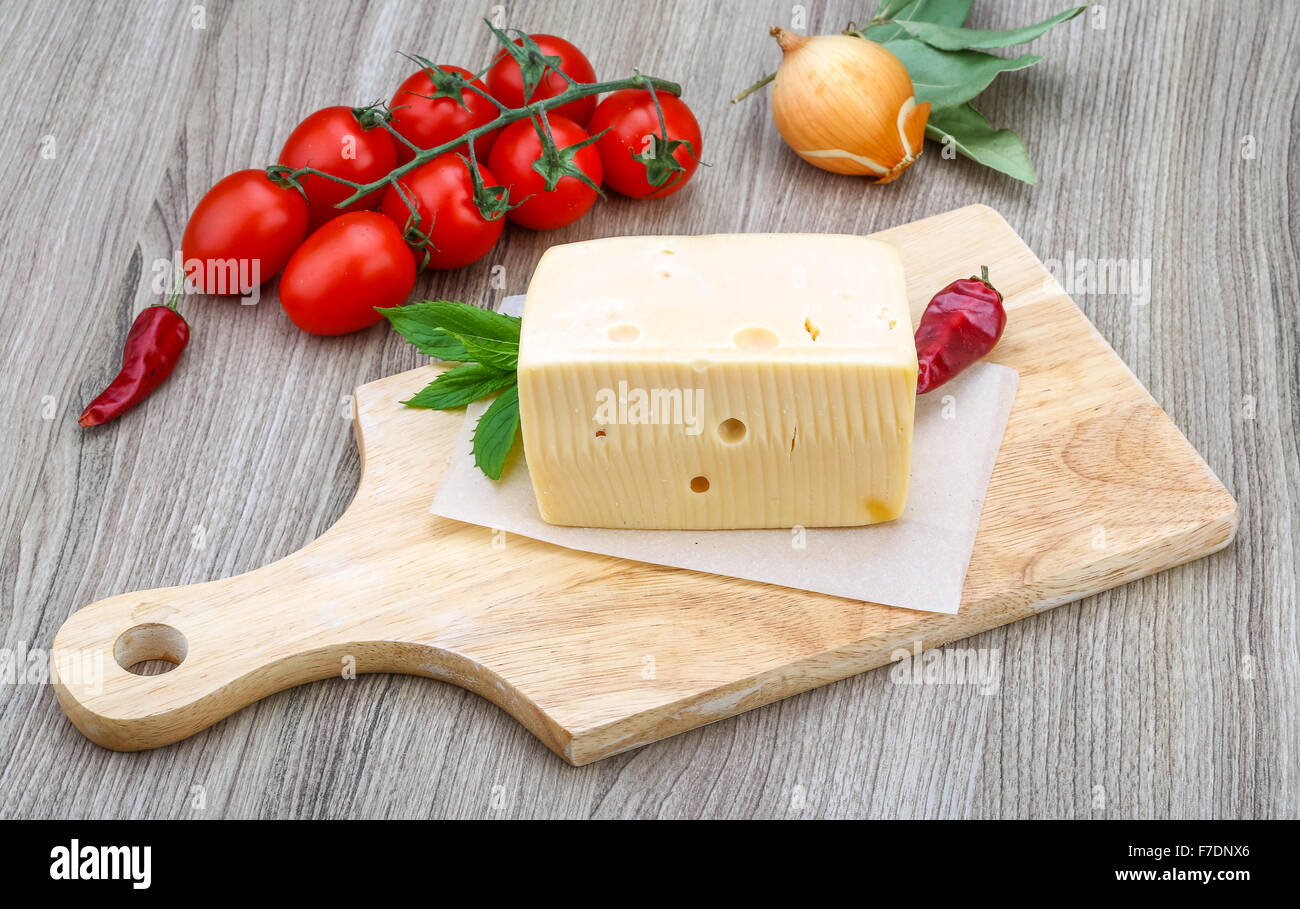 Yellow cheese brick with mint leaves on the wood background Stock Photo ...