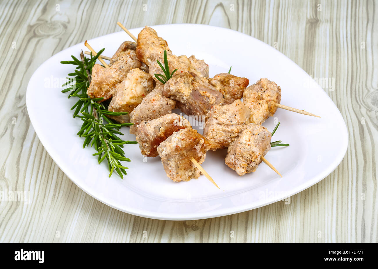 Chicken skewers with rosemary on the wwod background Stock Photo - Alamy