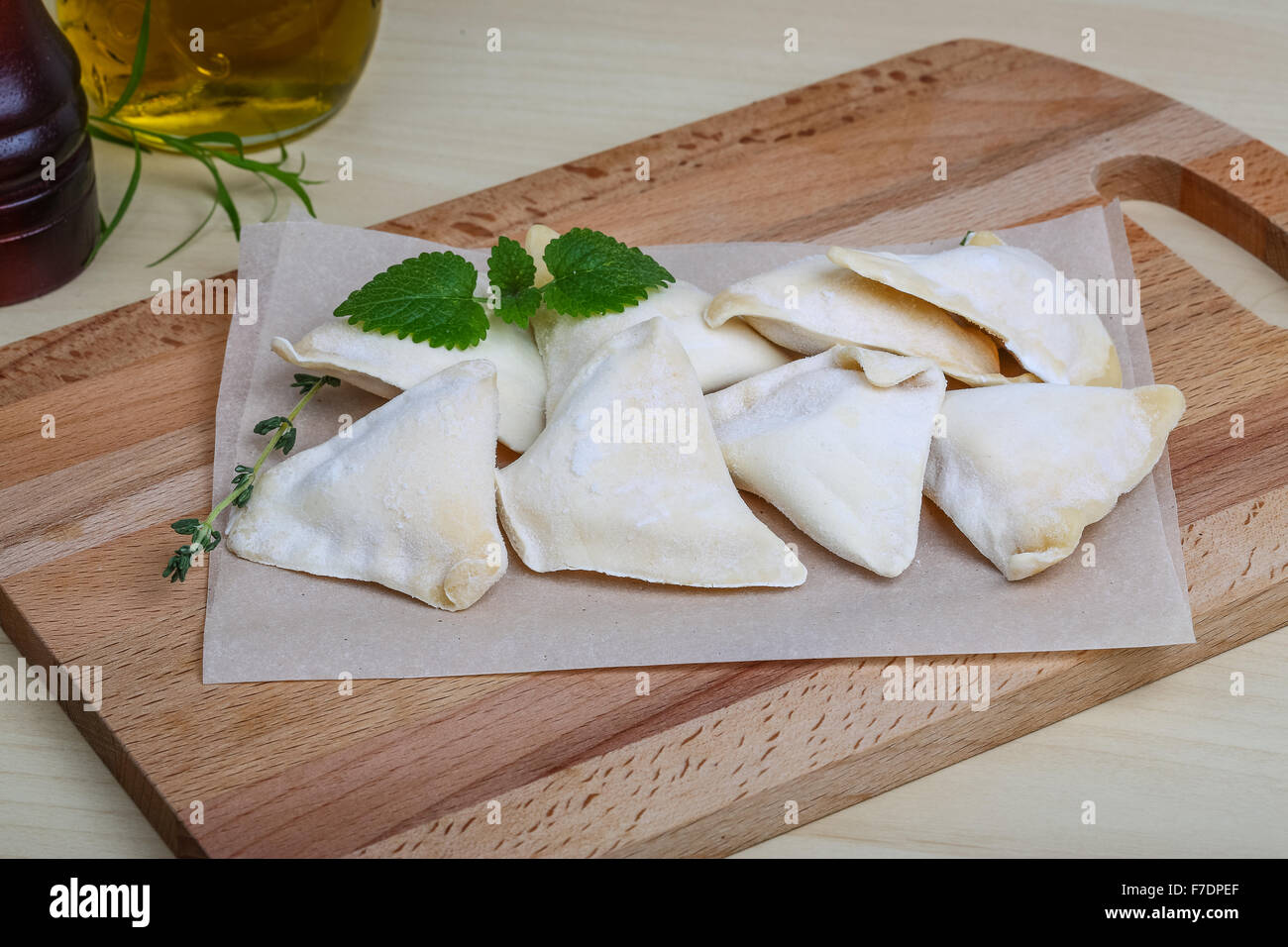 Raw potato dumplings - Ukrainian Vareniki served dill branch Stock ...