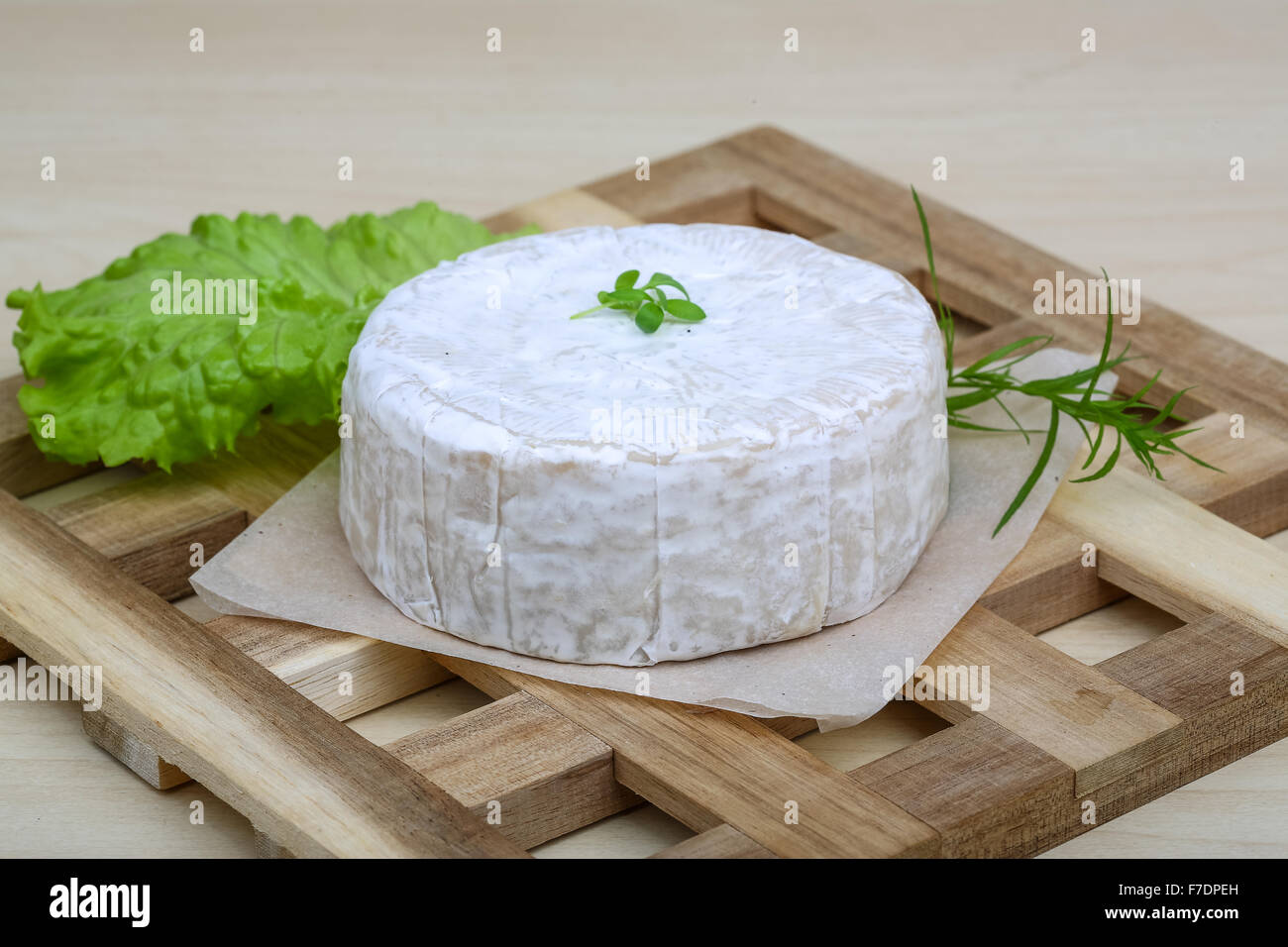 Camembert brie cheese with herbs on the wood background Stock Photo - Alamy