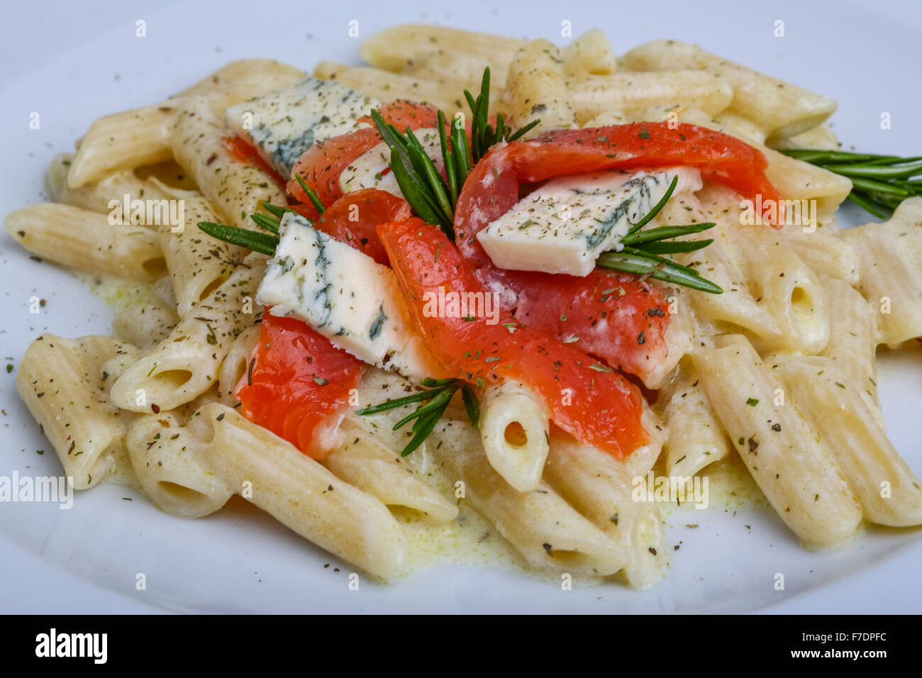 Italian pasta - penne with salmon and blue cheese Stock Photo - Alamy