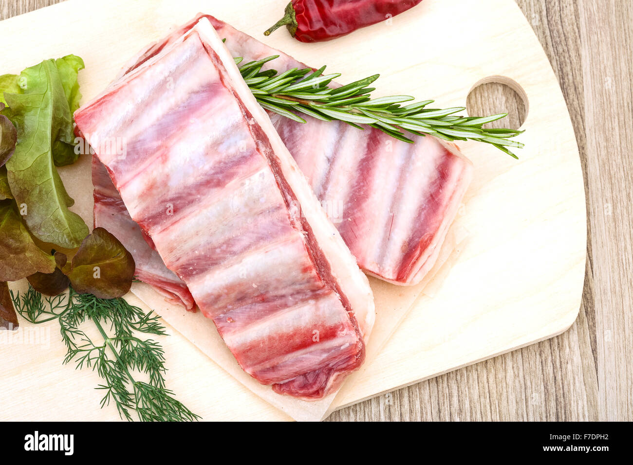 Fresh cold Raw lamb ribs with garlik and pepper - ready for cooking ...