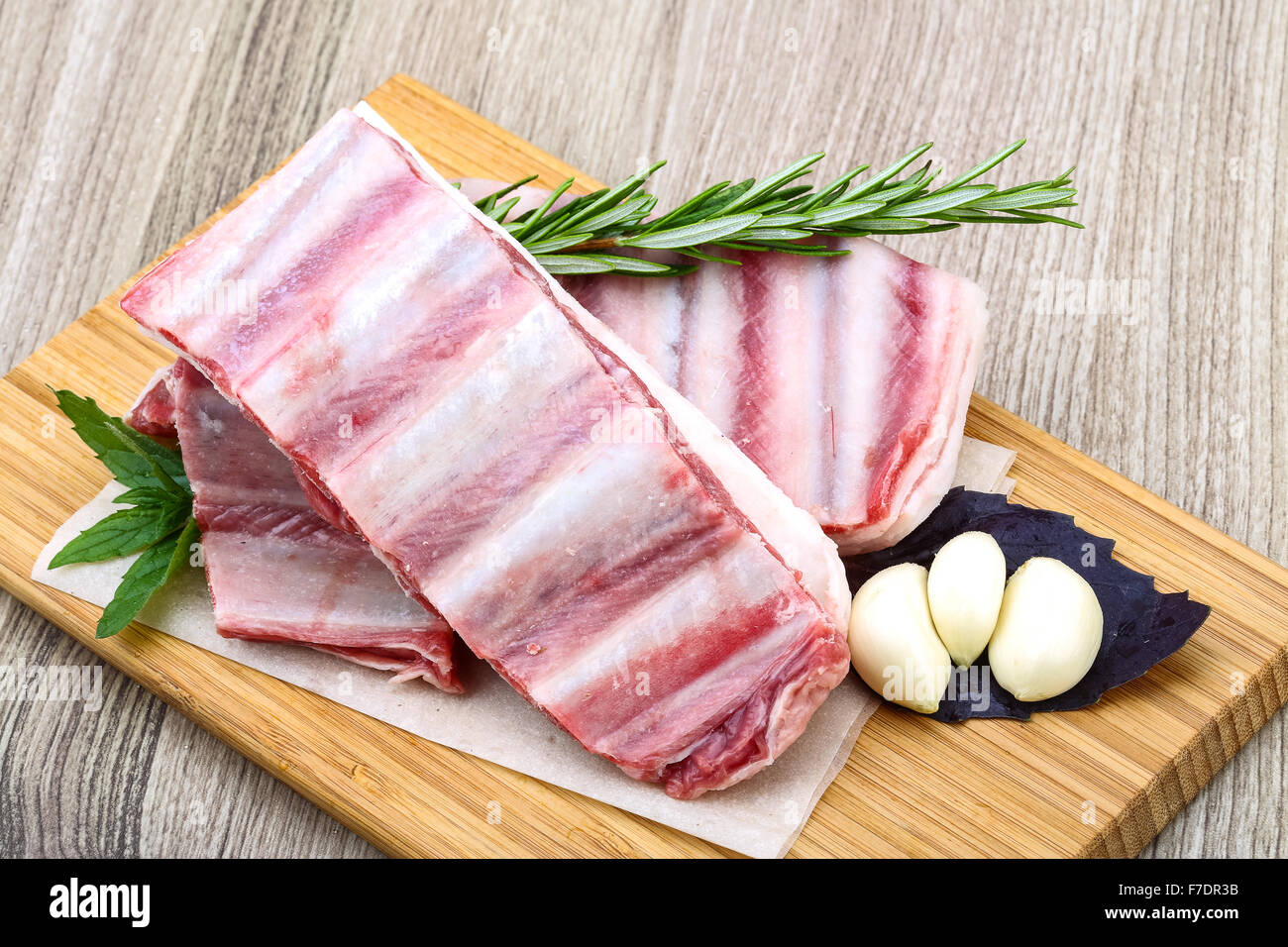 Fresh cold Raw lamb ribs with garlik and pepper - ready for cooking ...