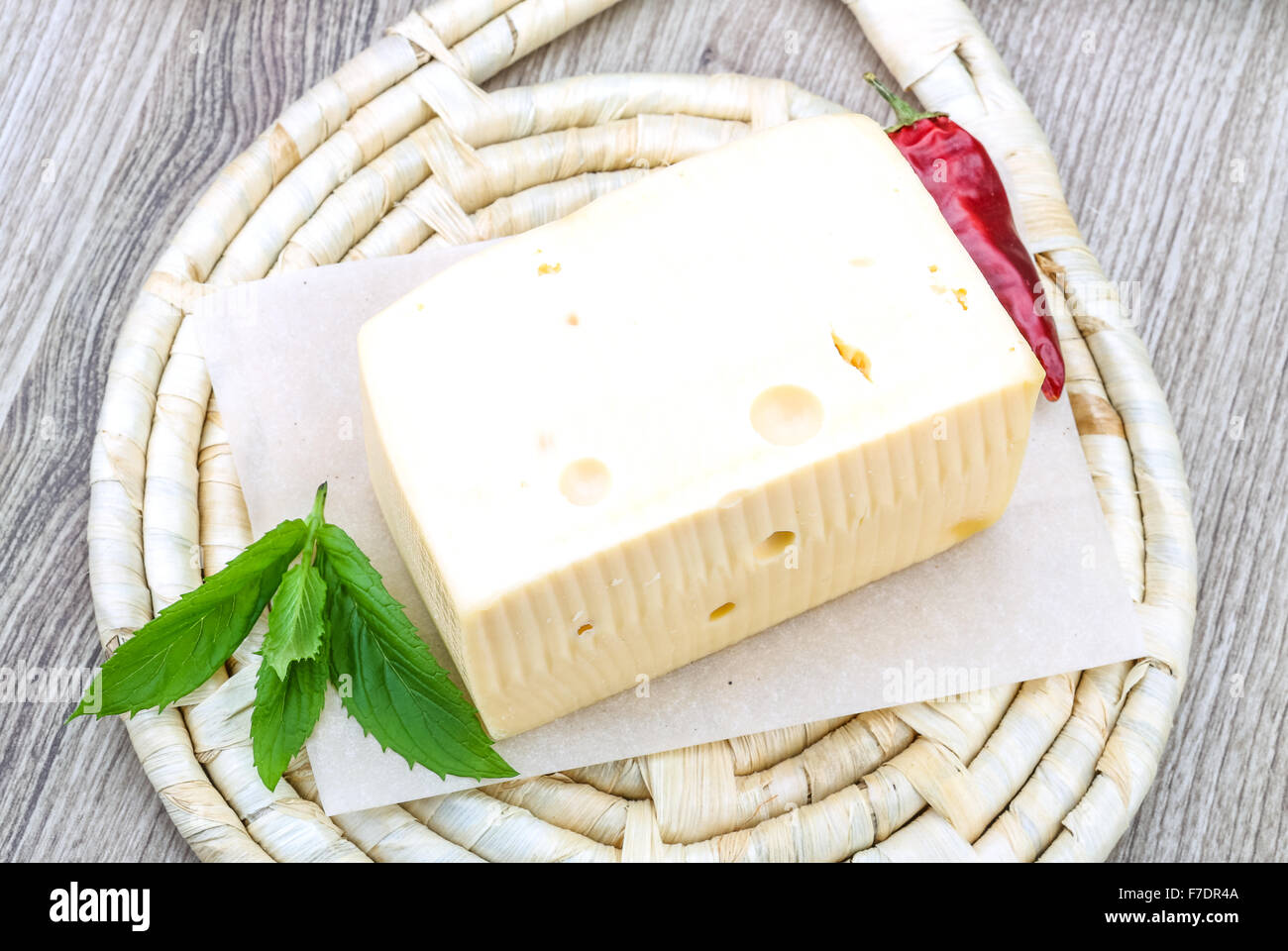 Yellow cheese brick with mint leaves on the wood background Stock Photo ...