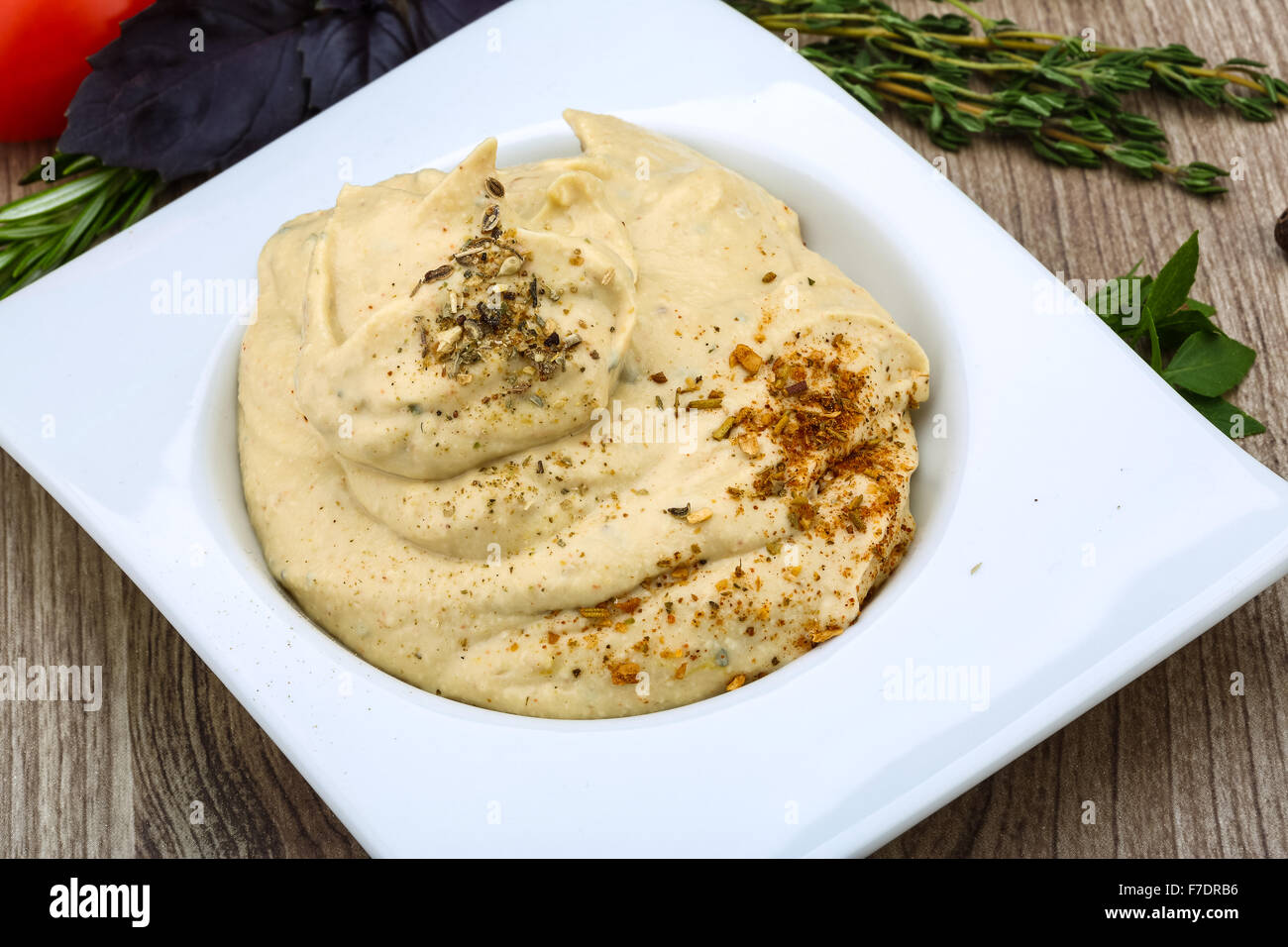 Arabic traditional cusine - hummus with olive oil, herbs and spices ...