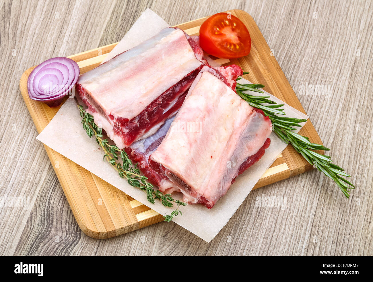 Raw beef ribs with rosemary and thyme - ready for cooking Stock Photo ...