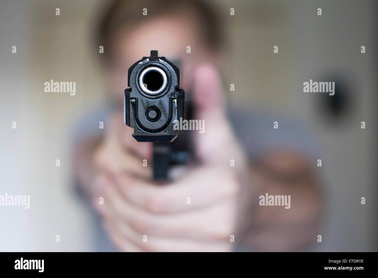 Man Aiming Pistol in Defense Stock Photo - Alamy