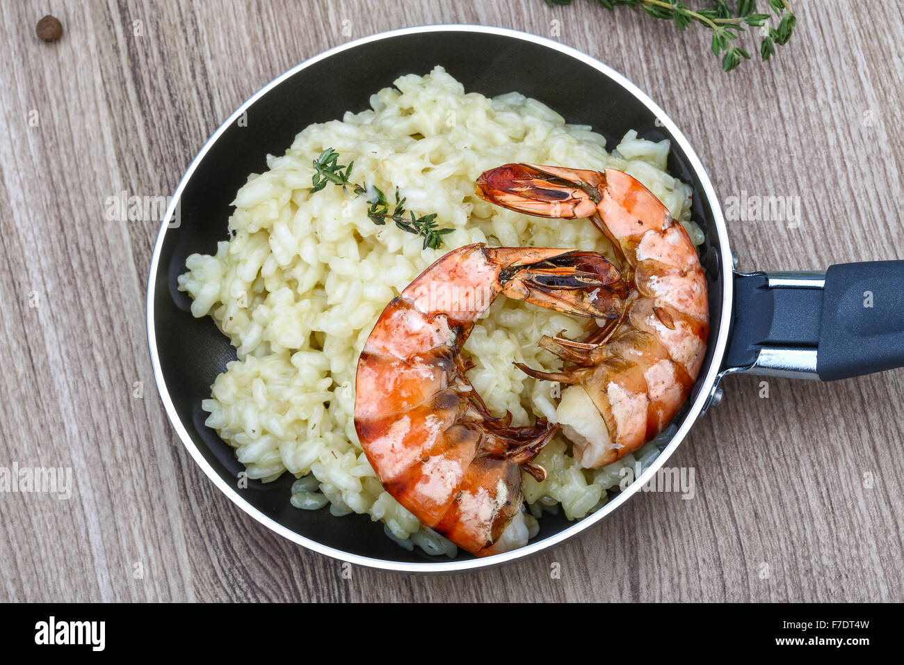 Italian trditional Risotto with tiger prawn and thyme Stock Photo - Alamy
