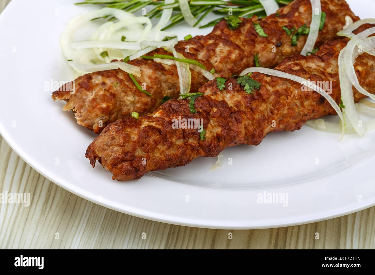 Hot Beef kebab with onion rings and rosemary Stock Photo - Alamy