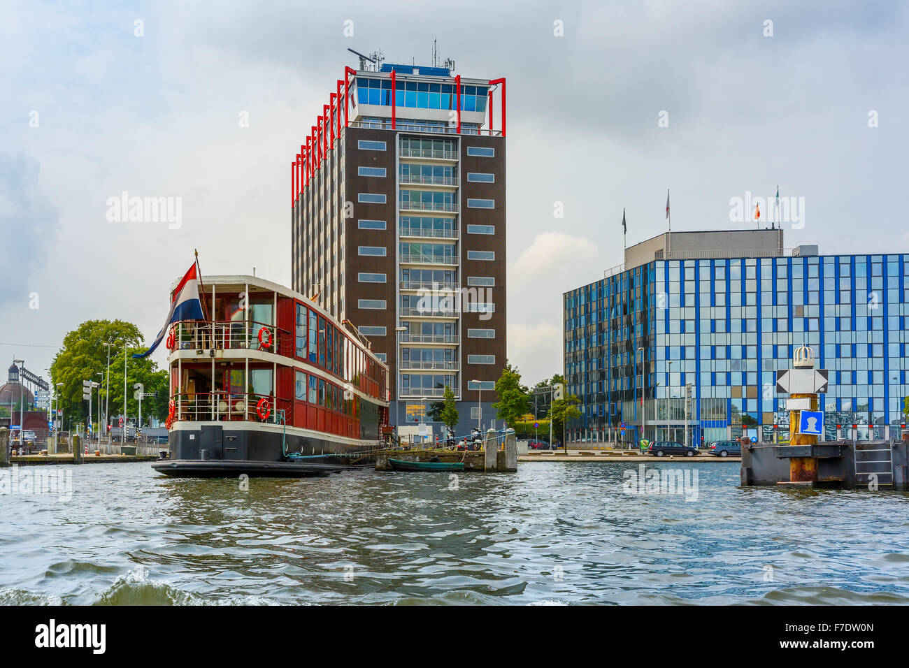 Amsterdam canal, boat and modern building, Holland Stock Photo - Alamy