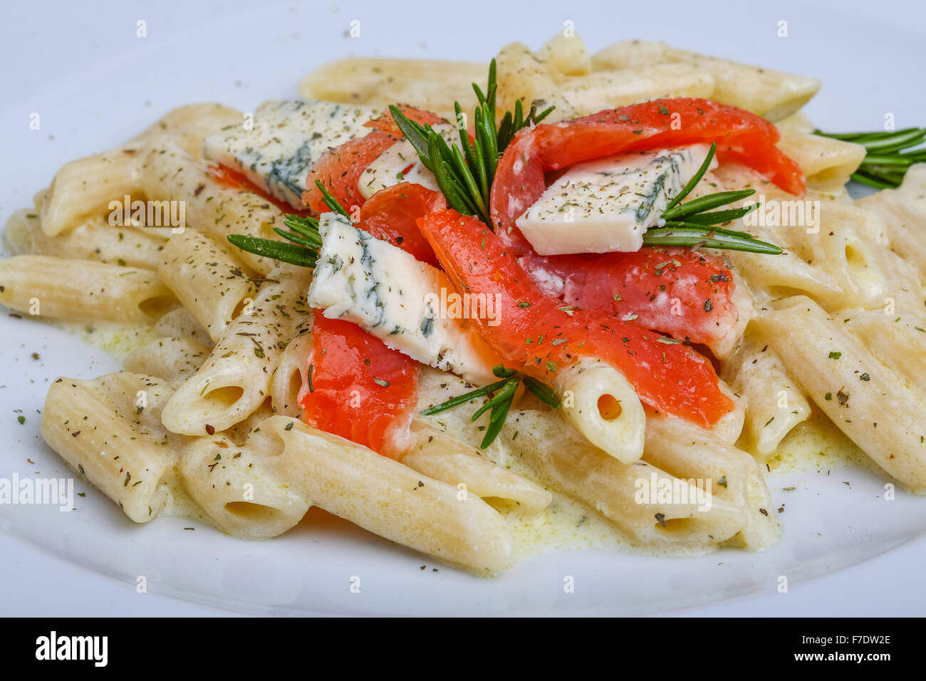 Italian pasta - penne with salmon and blue cheese Stock Photo - Alamy