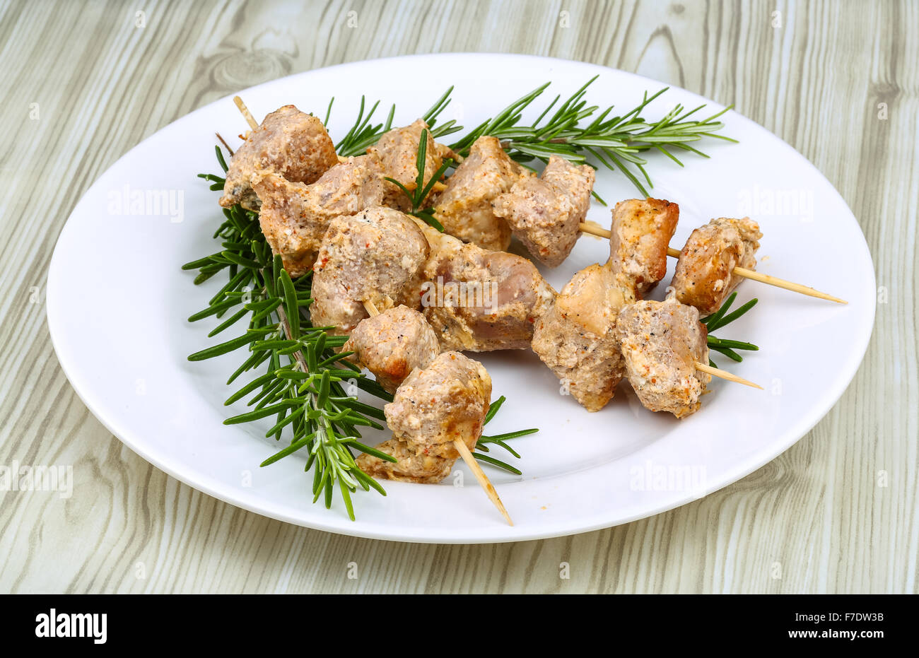 Chicken skewers with rosemary on the wwod background Stock Photo - Alamy
