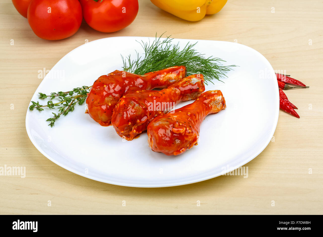 Chicken legs in red tomato sauce with rosemary Stock Photo - Alamy