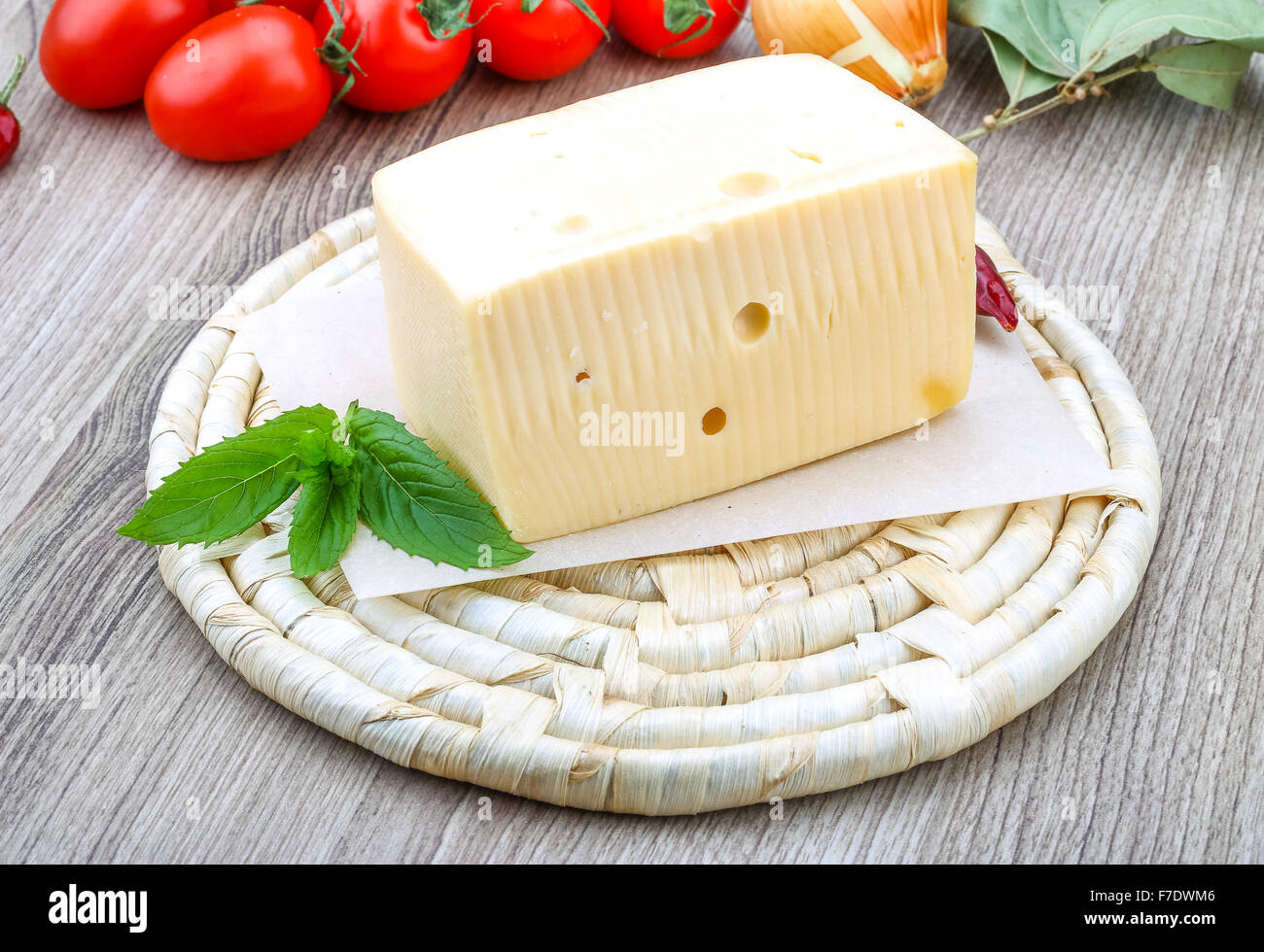 Yellow cheese brick with mint leaves on the wood background Stock Photo ...