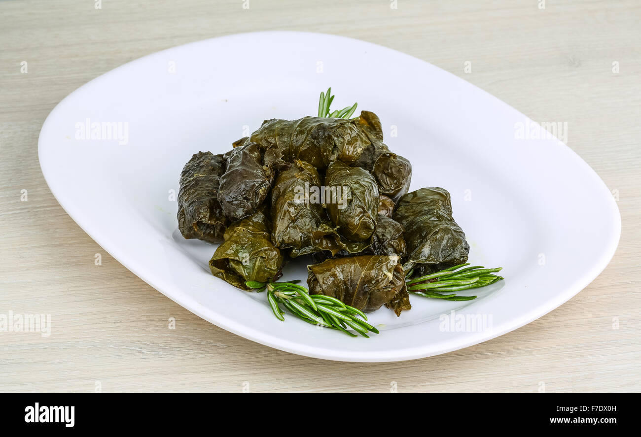 Greek dolma in grape leaves with meat served rosemary Stock Photo - Alamy