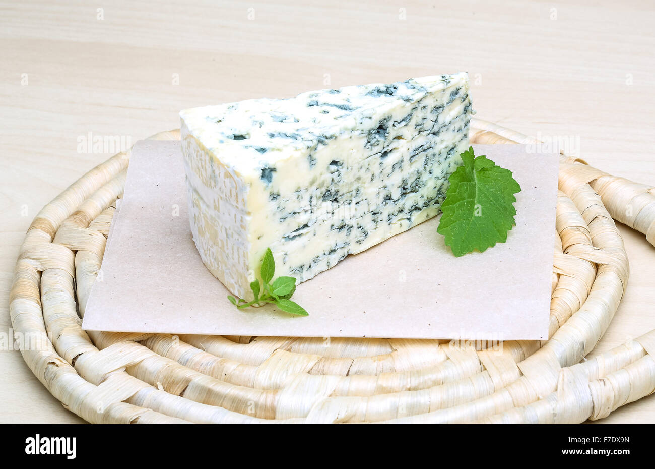 Dor Blue cheese with basil on the wood background Stock Photo - Alamy