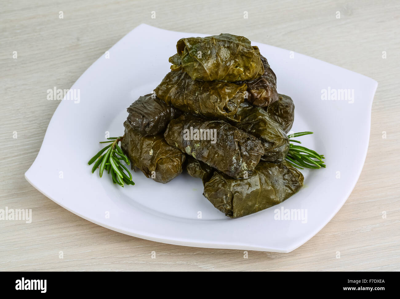 Greek dolma in grape leaves with meat served rosemary Stock Photo - Alamy