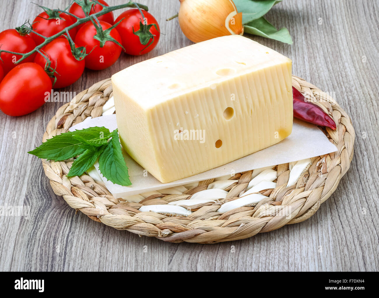 Yellow cheese brick with mint leaves on the wood background Stock Photo ...