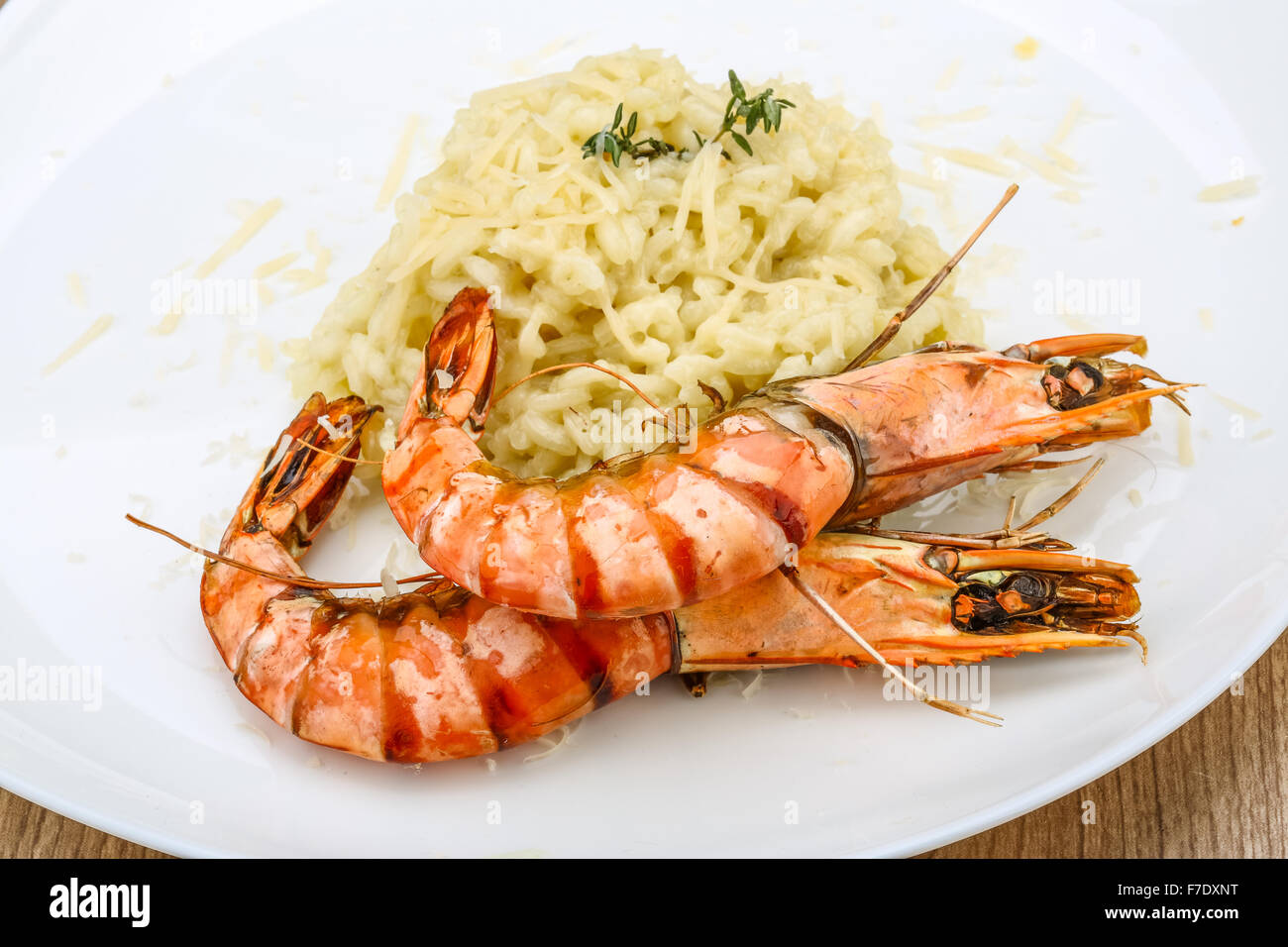 Italian trditional Risotto with tiger prawn and thyme Stock Photo - Alamy