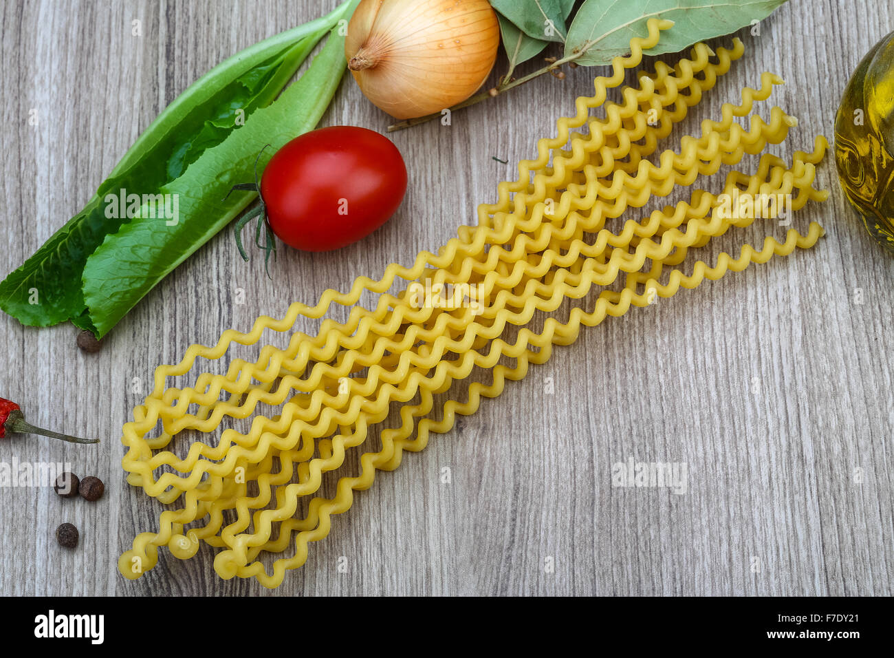 Long raw fusilli with olive oil and spices Stock Photo - Alamy