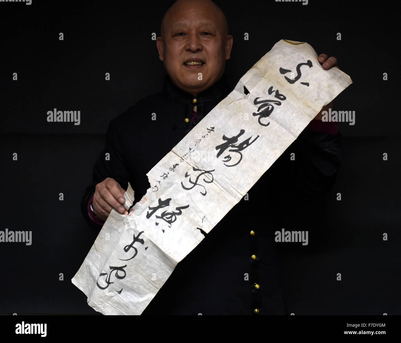 Beijing, China. 29th Nov, 2015. Artist Wang Yuwei shows the ancient ...