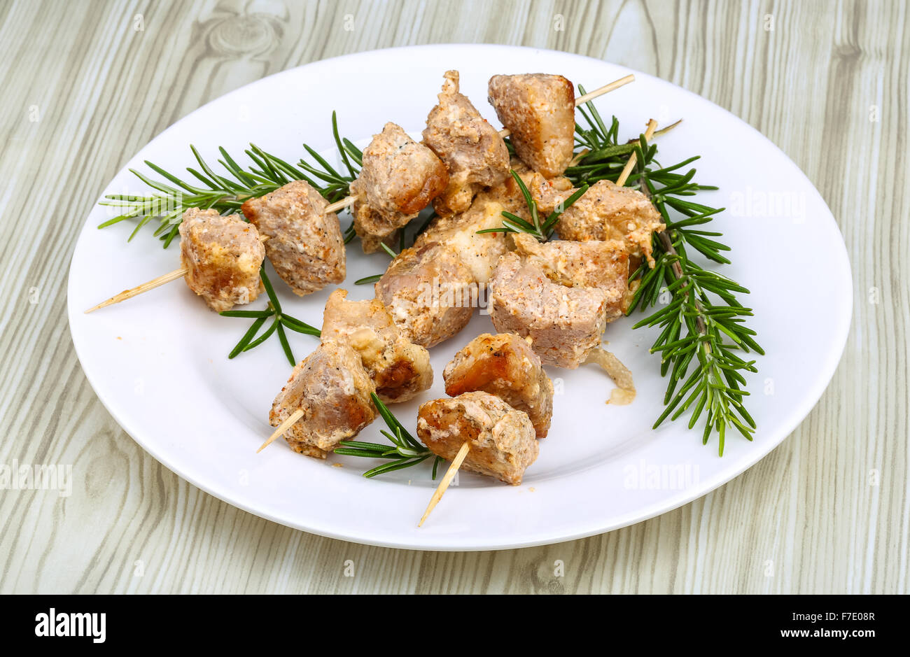 Chicken skewers with rosemary on the wwod background Stock Photo - Alamy