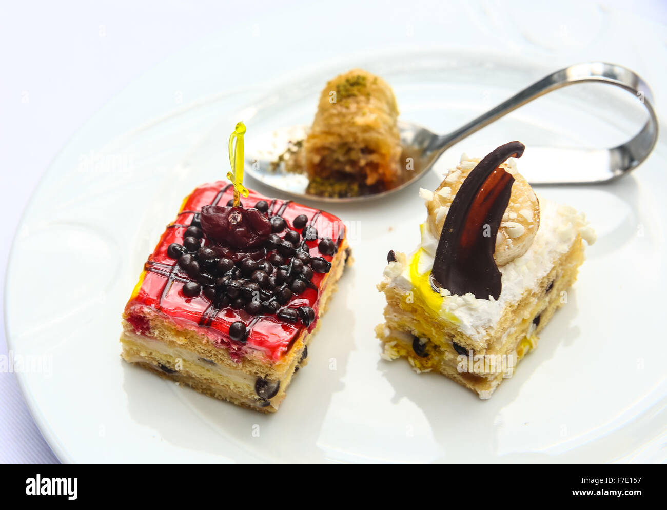 Mini cakes with berries and sweet cream Stock Photo - Alamy