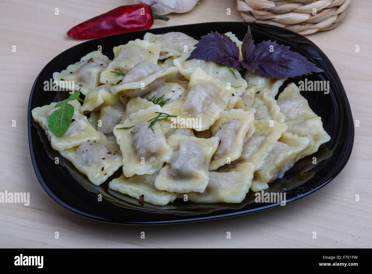 Italian dumplings Ravioli with fresh herbs and spices Stock Photo - Alamy