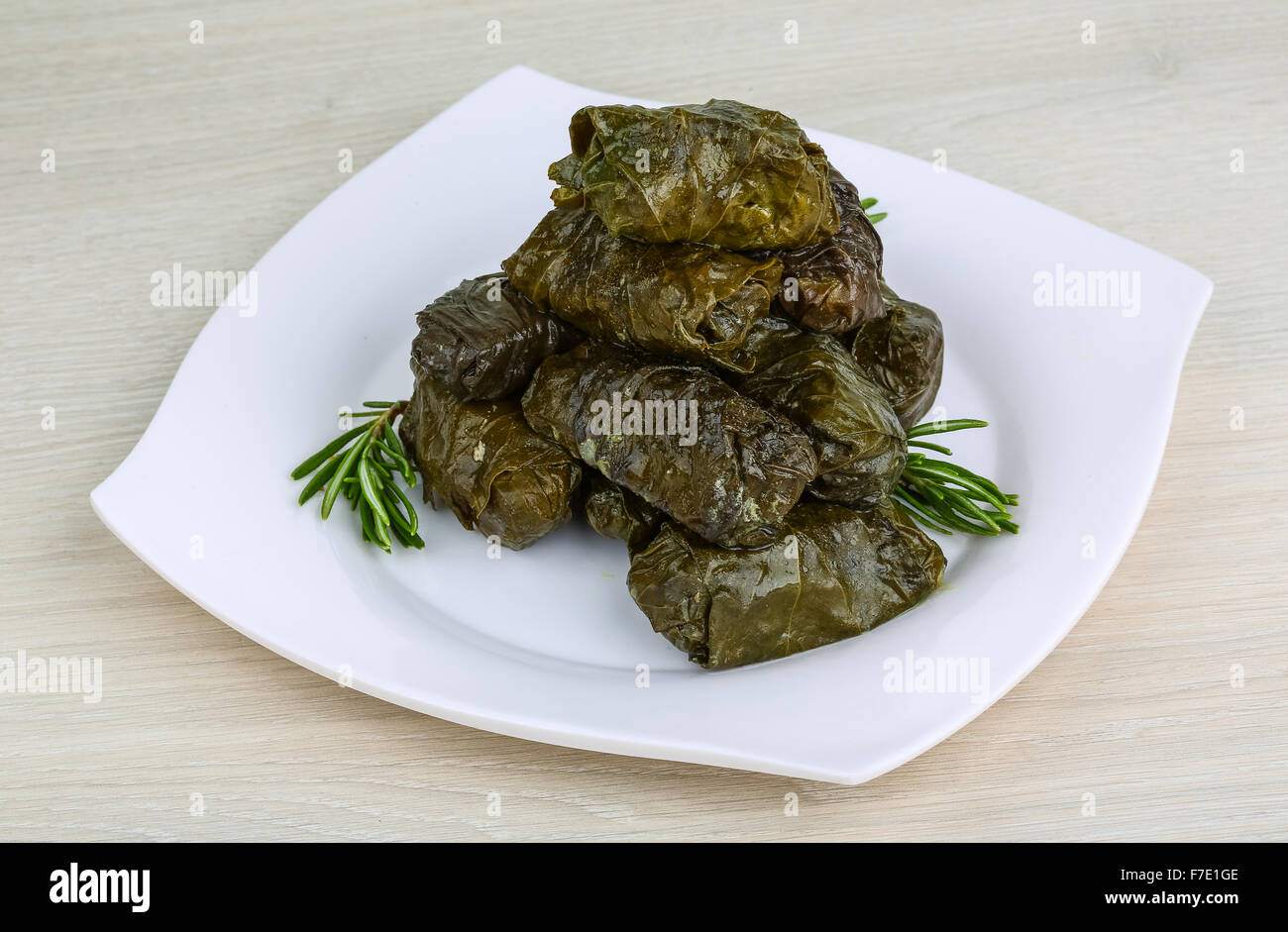 Greek dolma in grape leaves with meat served rosemary Stock Photo - Alamy