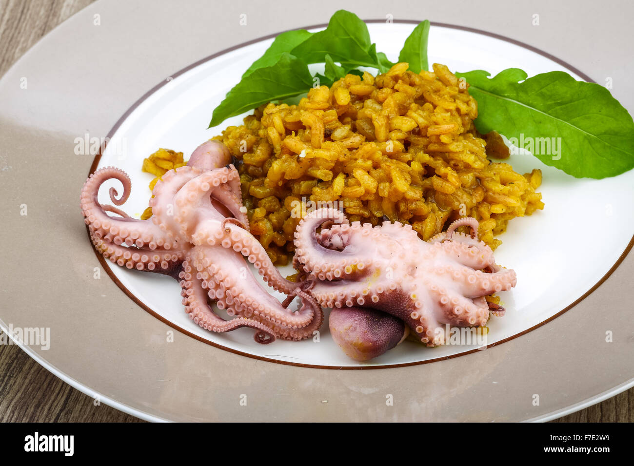 Seafood risotto with octopus, cheese and thyme leaf Stock Photo - Alamy