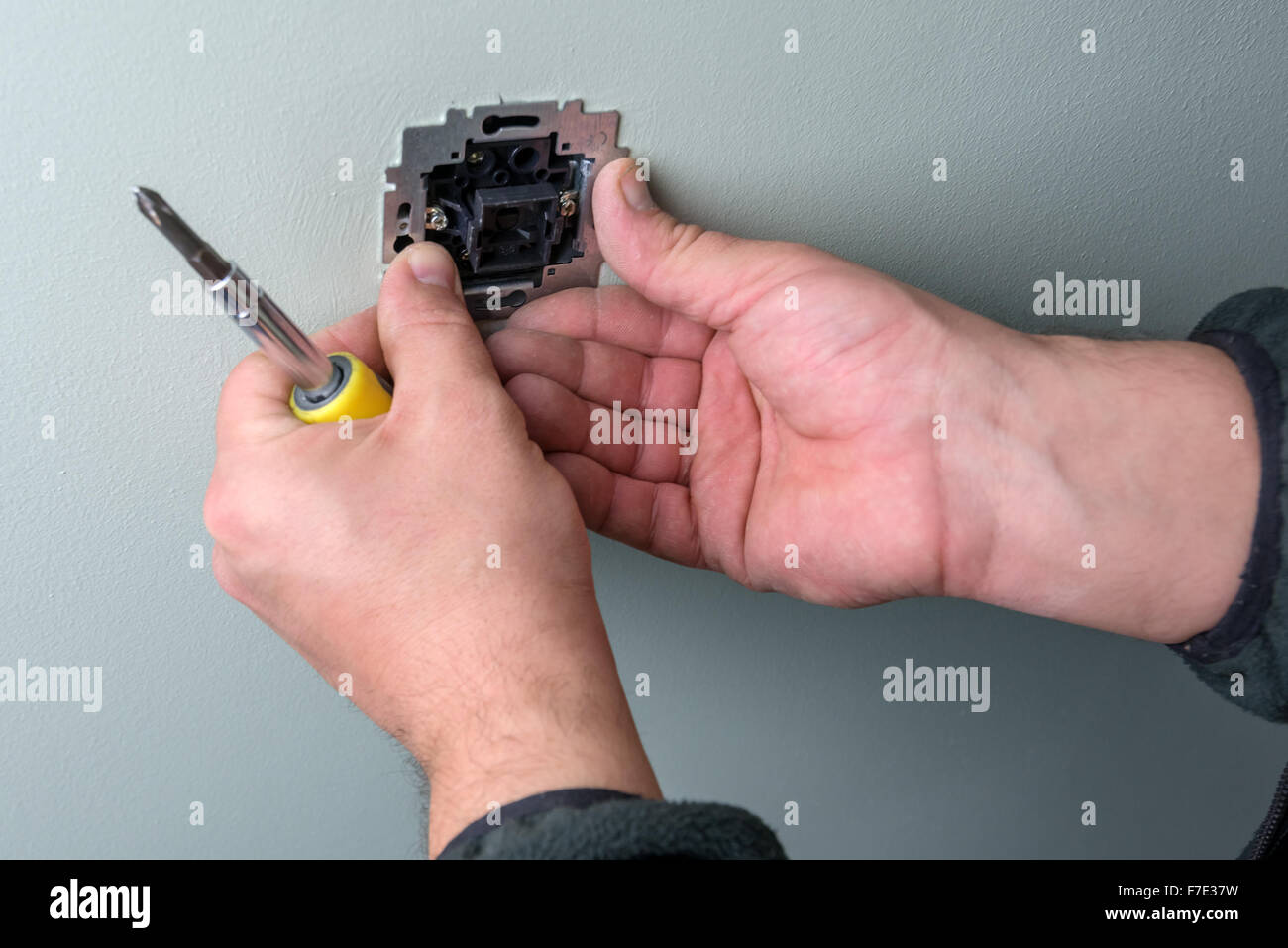 electrician installing the electricity system Stock Photo - Alamy