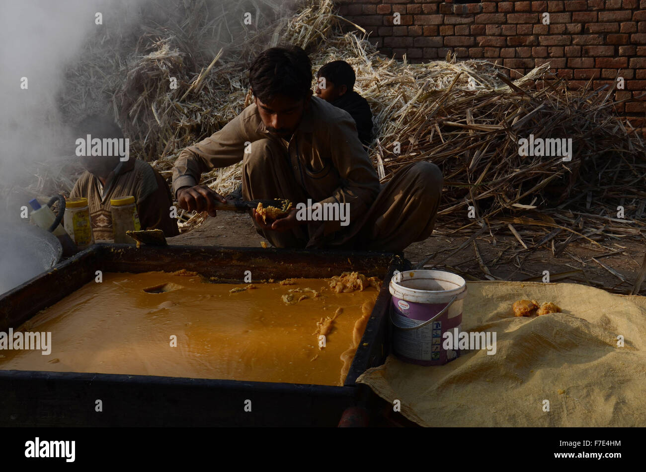 Lahore, Pakistan. 30th Nov, 2015. Pakistani farmers pouring boiled ...